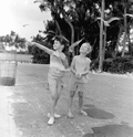 Florida Memory • Two friends having fun modeling swimwear at the beach