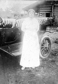Florida Memory • Lily Futch standing next to a car